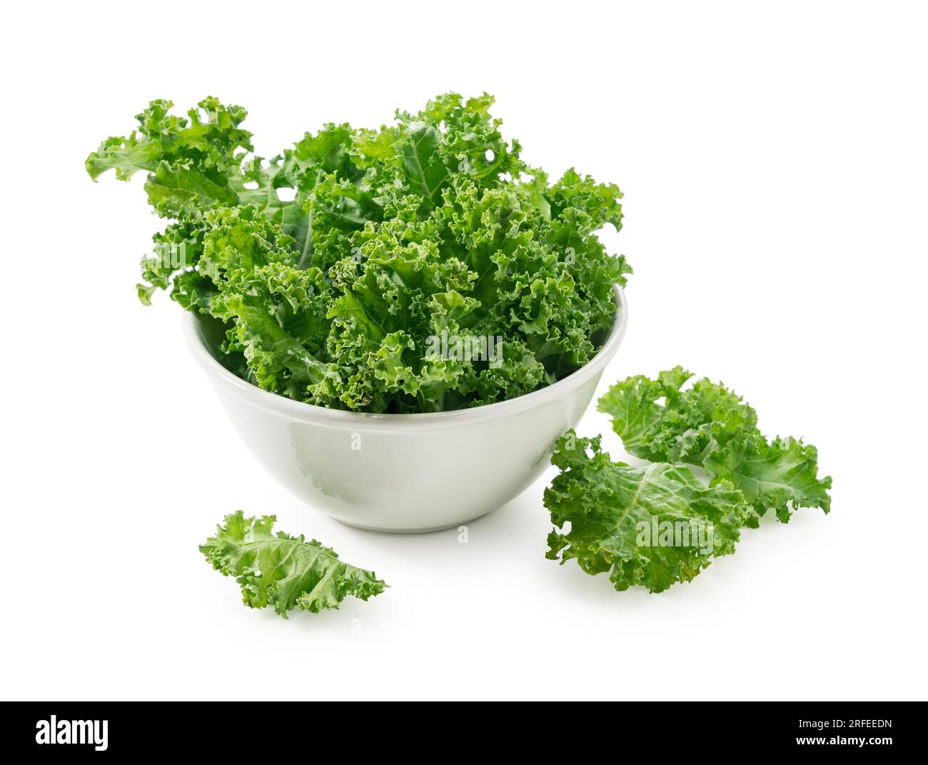 Kale in bowl on white background. curly kale Stock Photo - Alamy