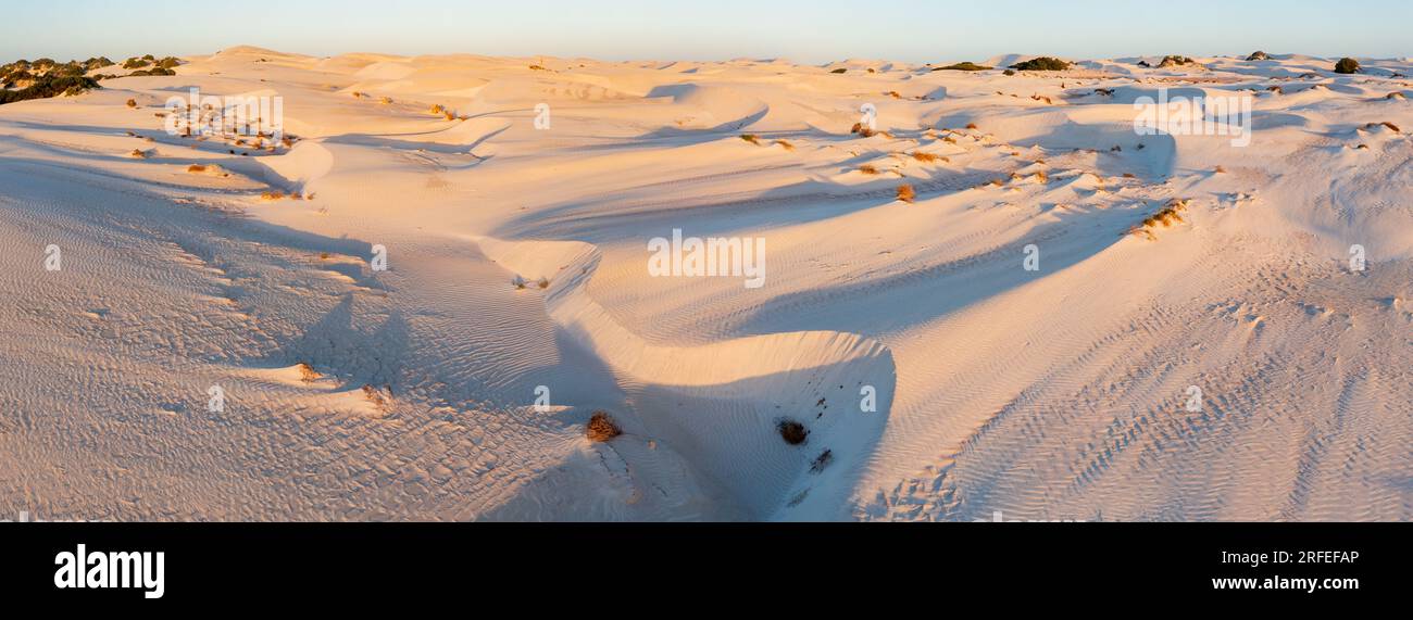 Aerial panoramic view of white sand dunes covered in ripples and ...