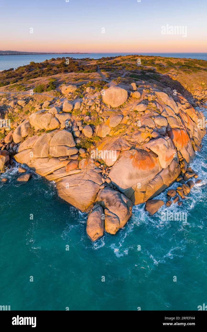 Aerial view of a rocky coastal island, with lichen covered boulders at ...