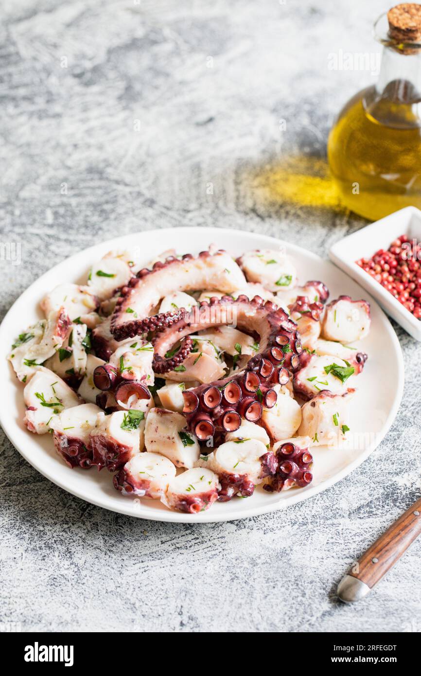 boiled chopped octopus on a concrete table Stock Photo - Alamy