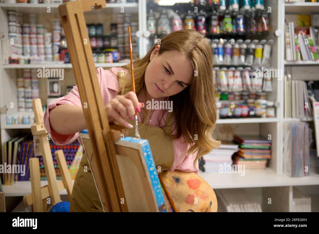 Closeup portrait of inspired pretty woman painter, female artist ...