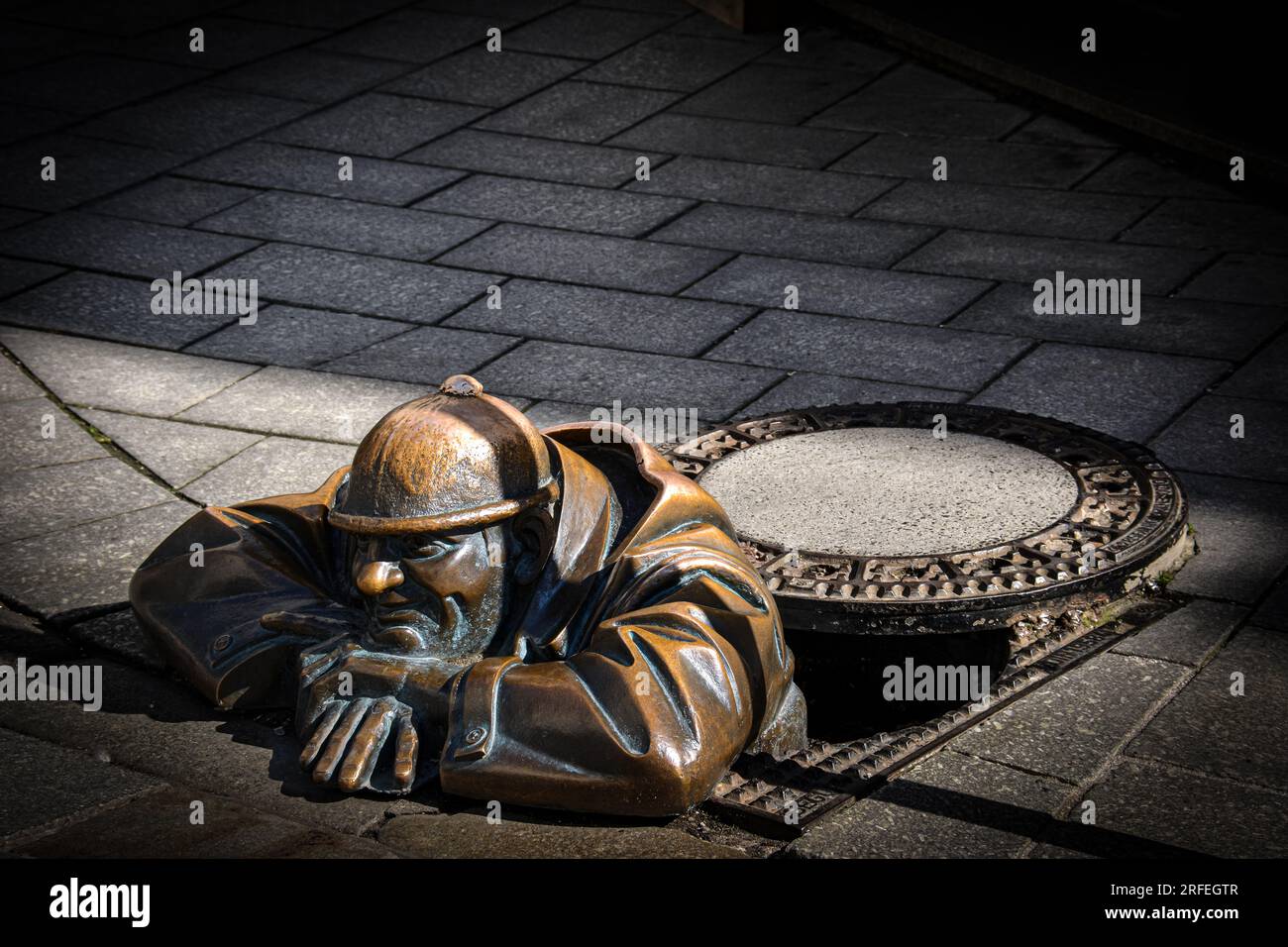 The Famous Statue of Cumil the Sewer Worker in Bratislava, Slovakia ...