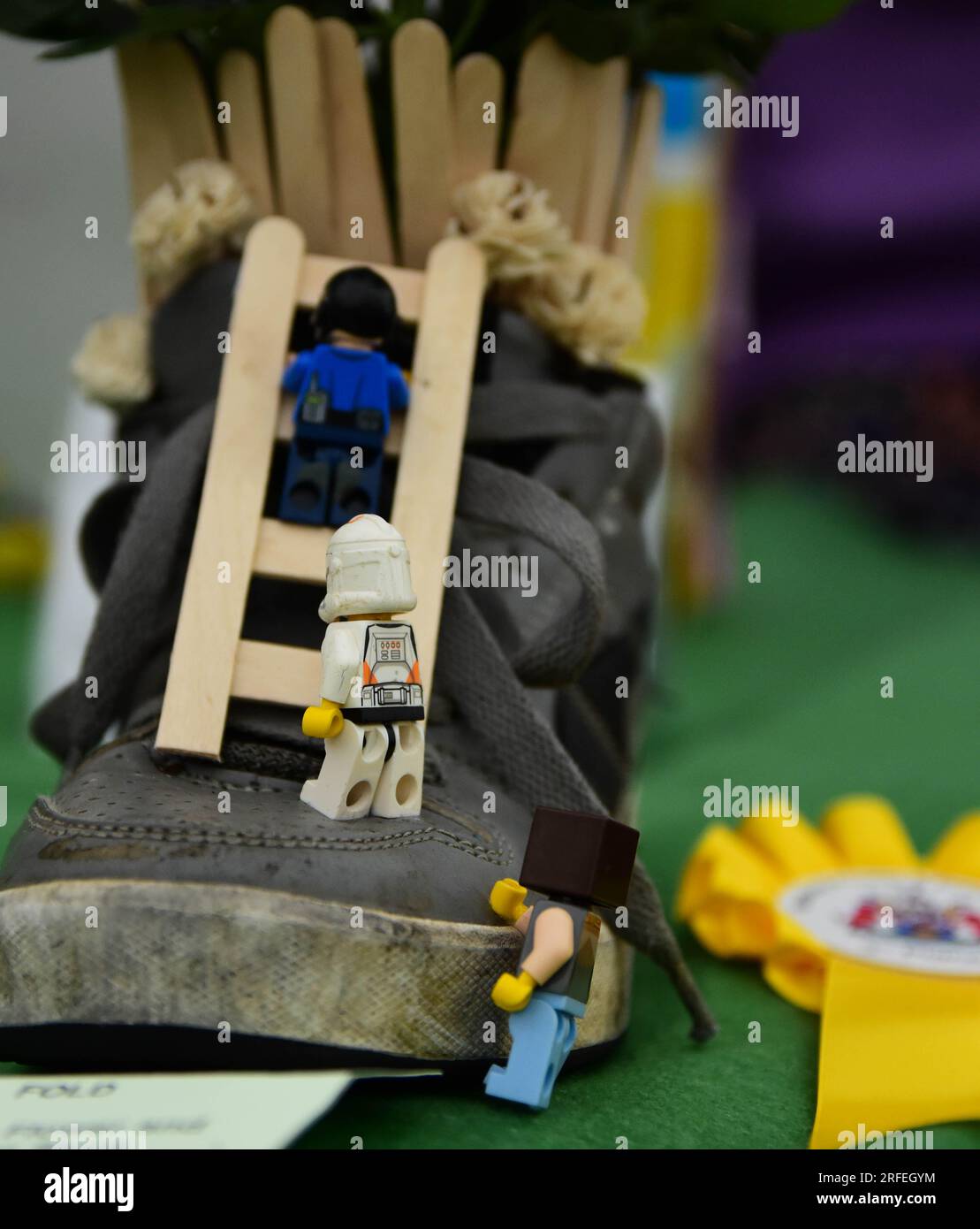 Floral arrangement with lego people accessories using a boot as a vase ...