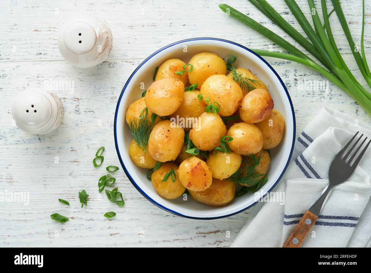 Boiled new or young potatoes with butter, fresh dill and onions in ...