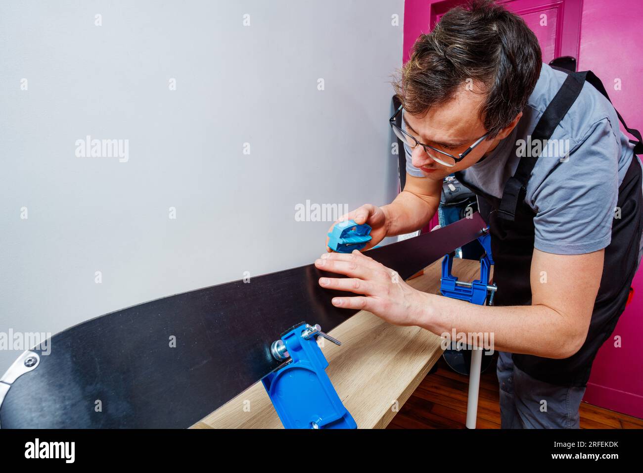 Professional do maintenance of ski sharp edge with care in vises Stock ...