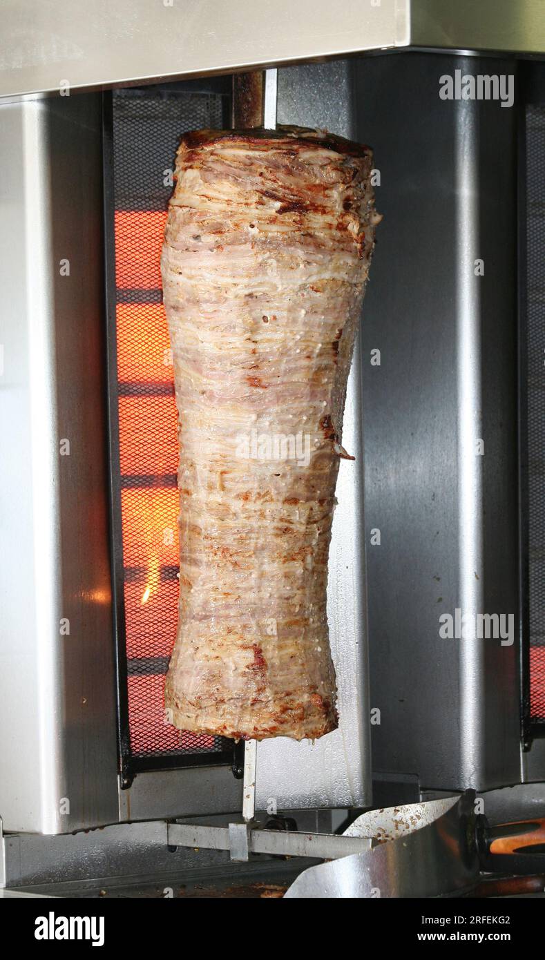 Delicious Greek Food Chicken Gyros cooking on Grill in Samos, Greece ...