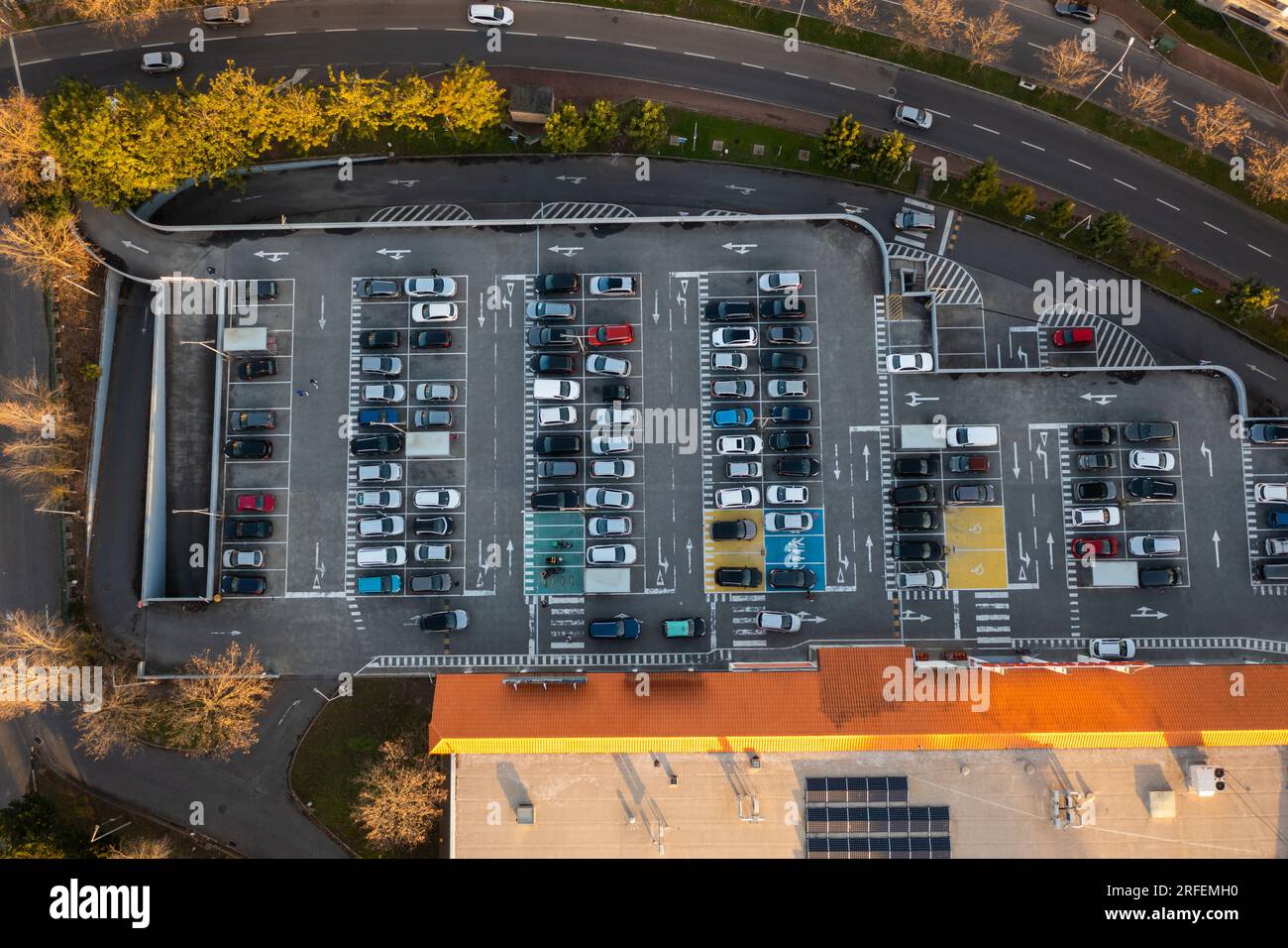 Aerial view of large parking lot in front shopping mall with many ...
