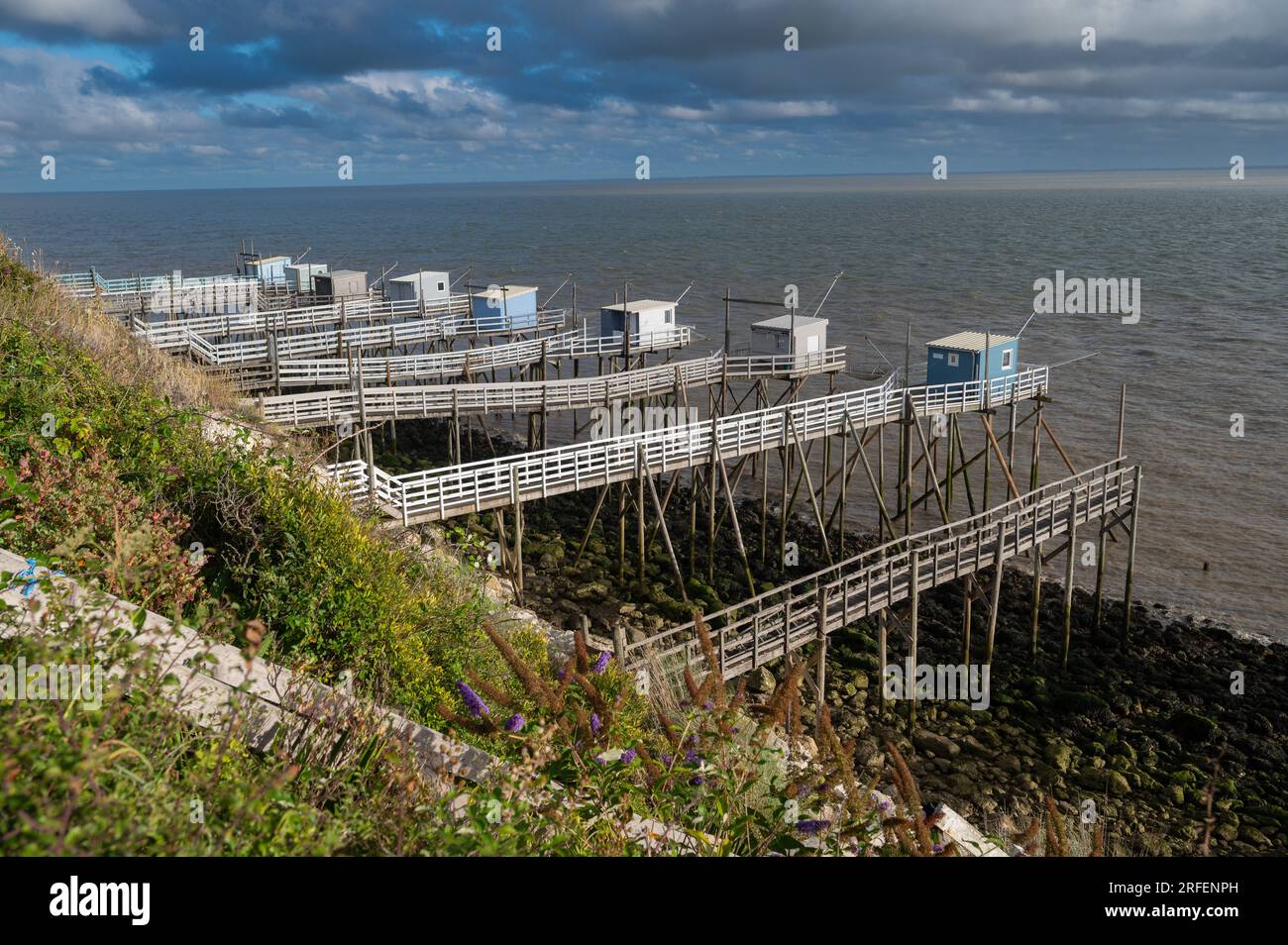 Traditional fisherman's wooden hut at the bottom of the limestone cliff ...