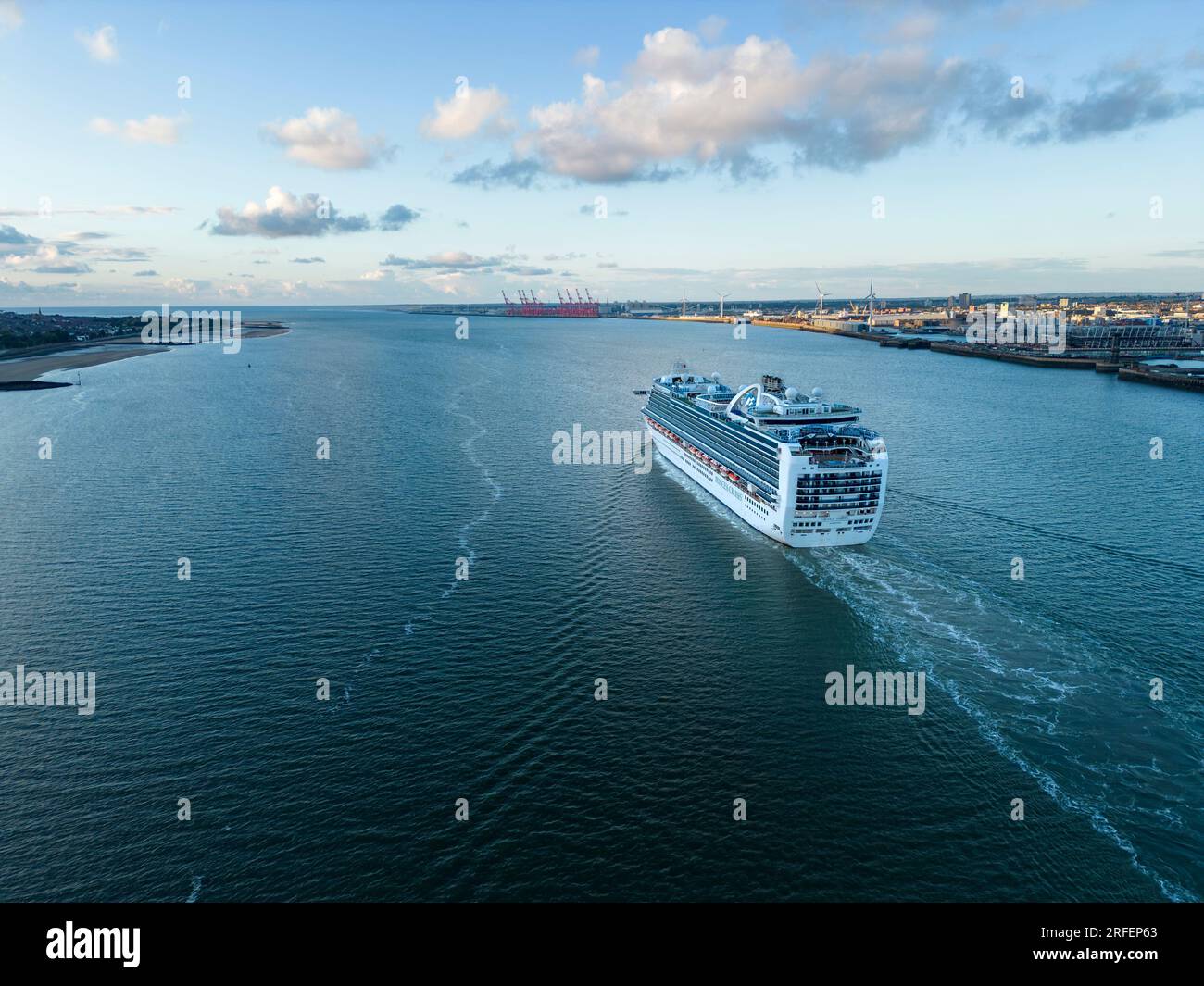 Aerial, MS Emerald Princess cruise ship sails down the River Mersey ...
