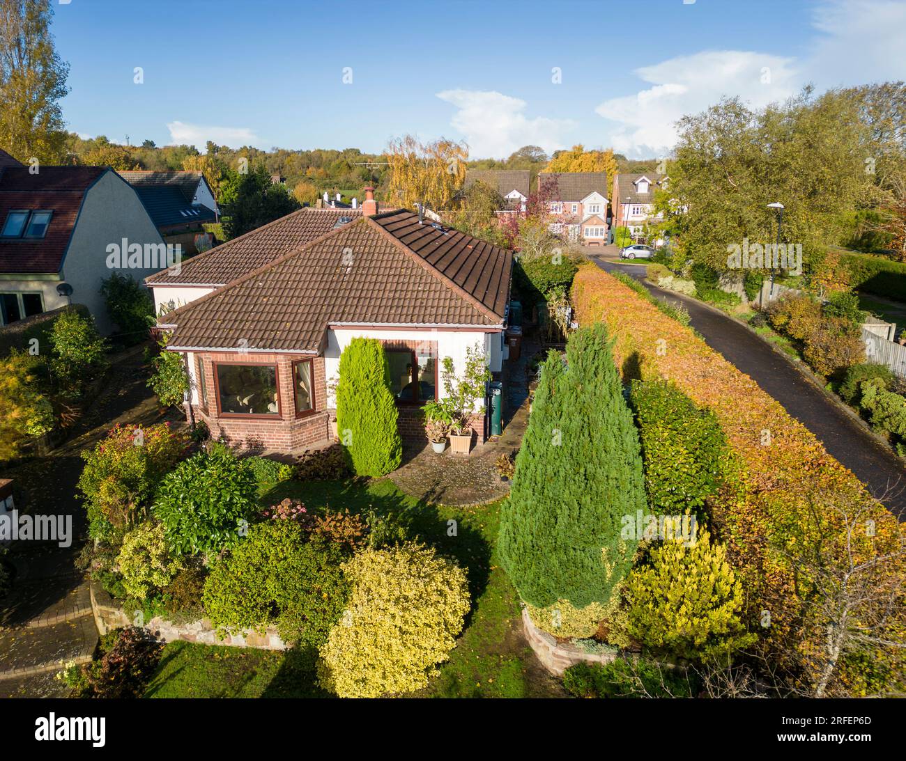 Aerial view of bungalow and front garden in a suburban setting England ...