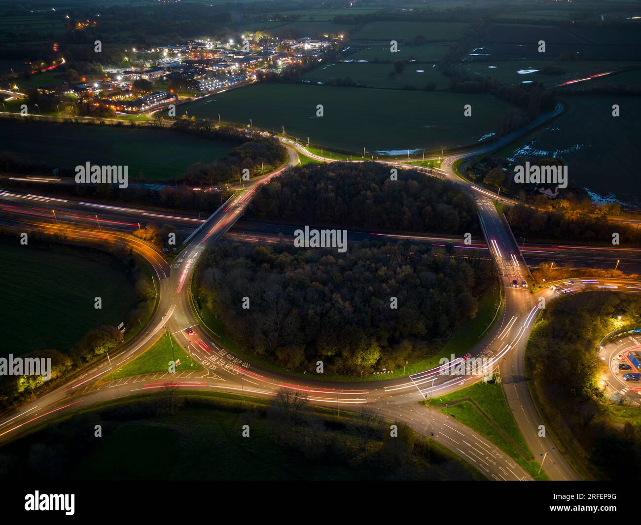 Aerial view of M53 J4 Clatterbridge Interchange roundabout at night ...
