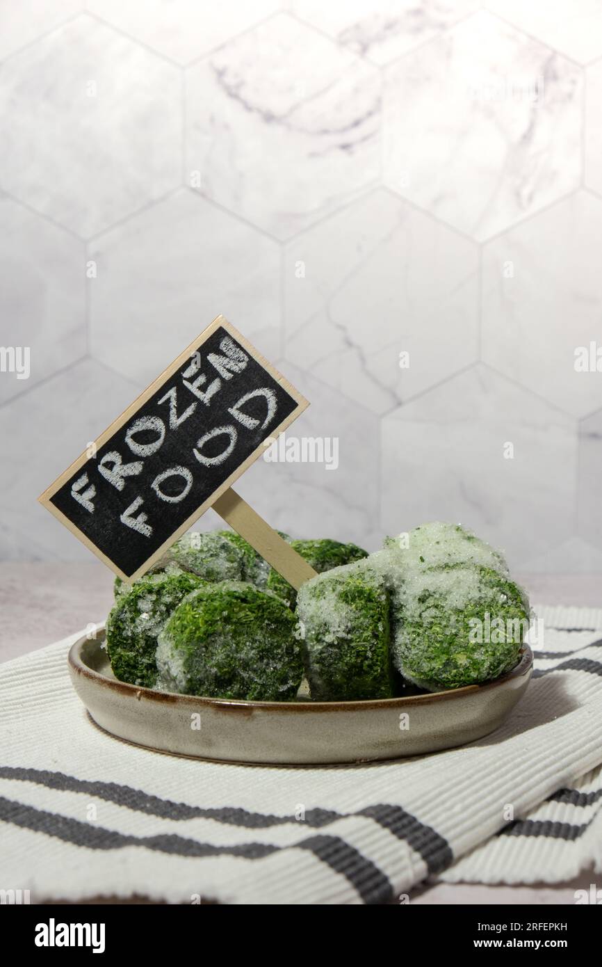 Frozen food spinach cubes with blackboard label text FROZEN FOOD ...