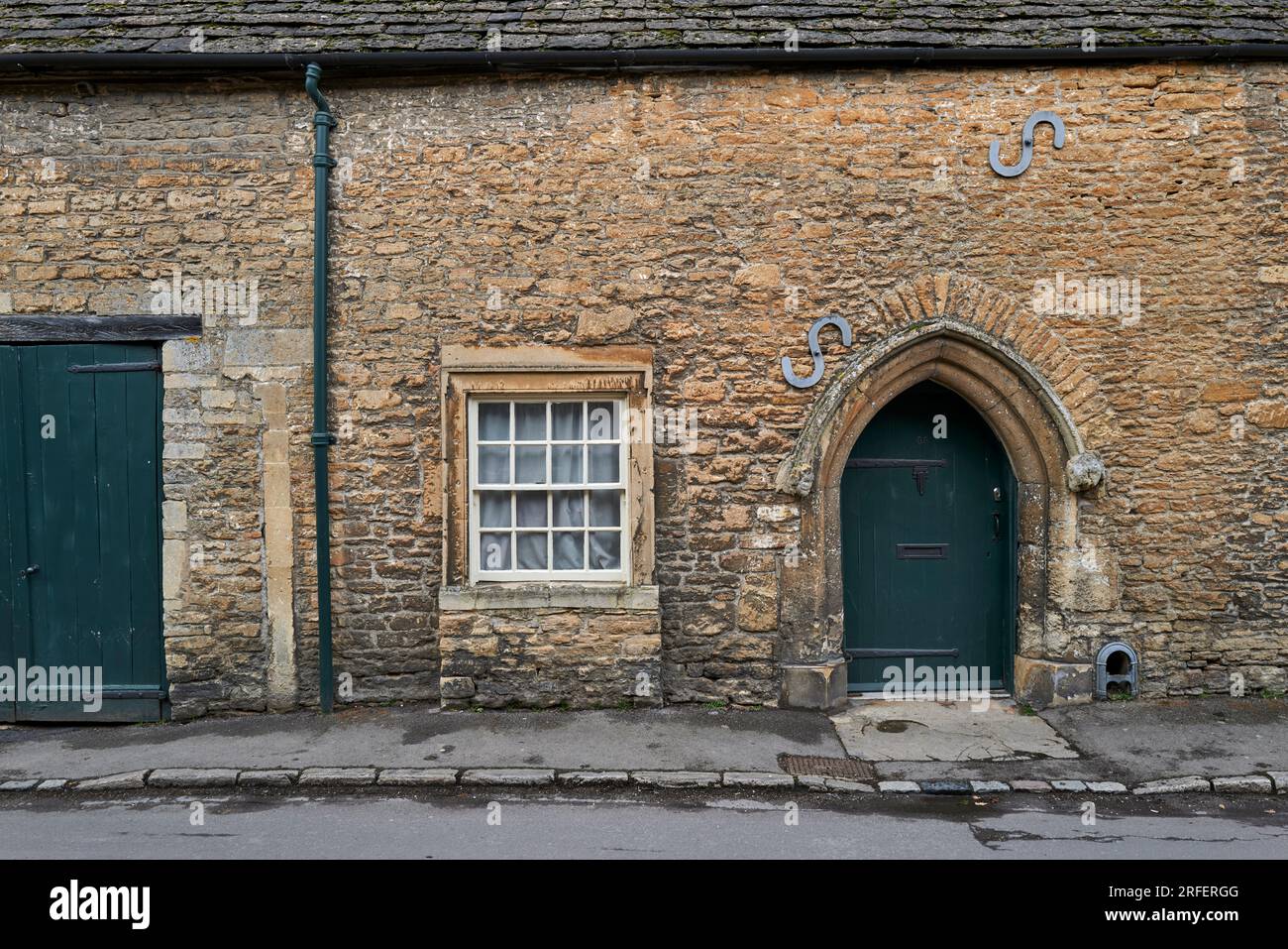 Pretty stone cottage with arch in Laycock, Wiltshire, UK Stock Photo ...
