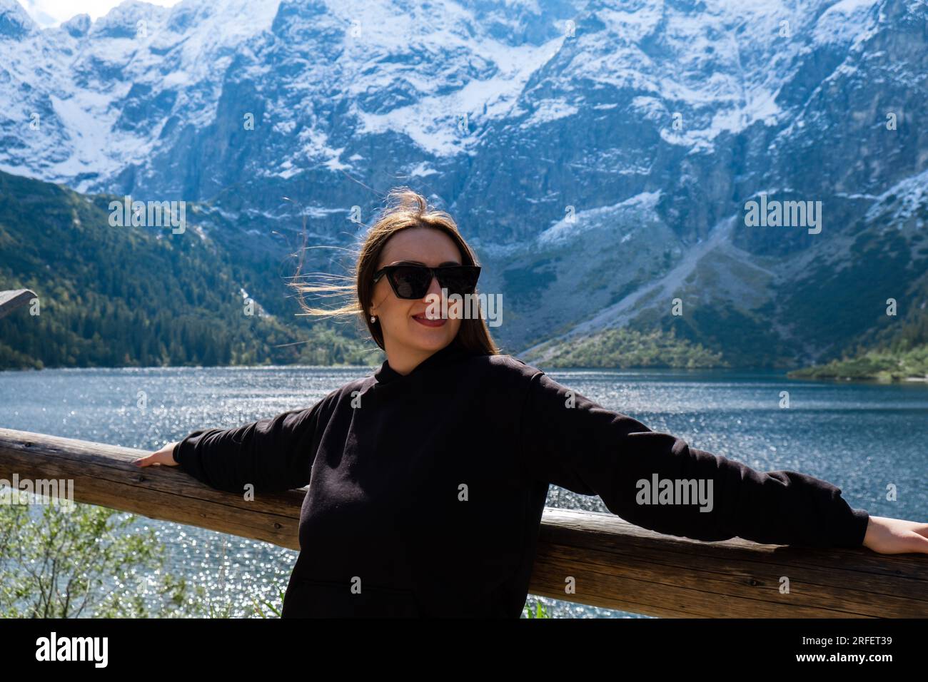 Young woman enjoying nature in Morskie Oko Snowy Mountain Hut in Polish ...