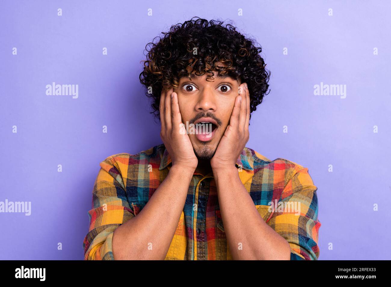 Photo of young man hands cheeks unexpected reaction open mouth wavy ...