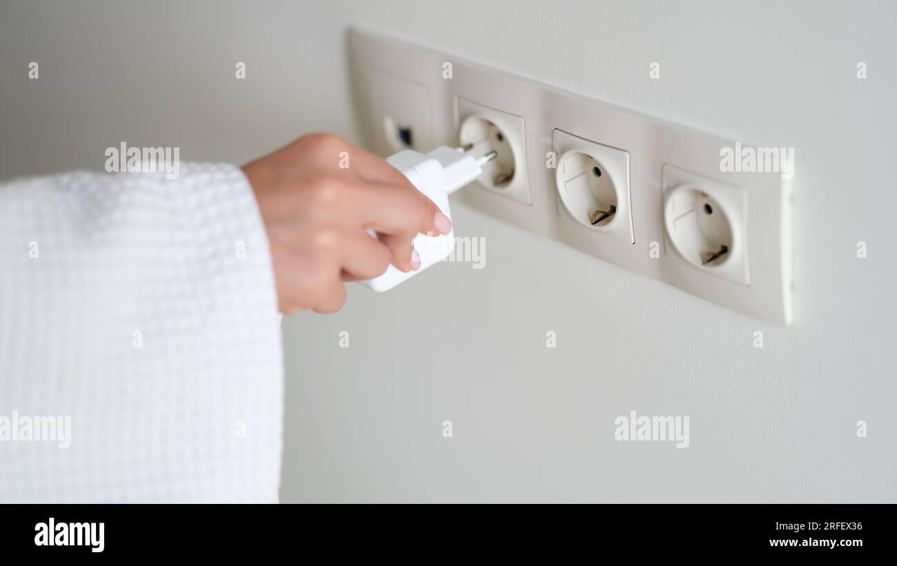 Young woman holding socket hi-res stock photography and images - Alamy