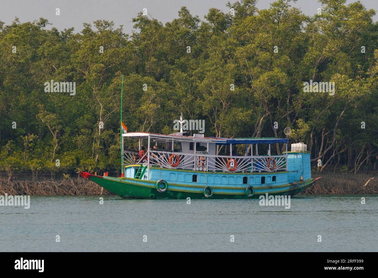 Tourist boat in an inlet of the Sunderbans, Ganges Delta, Bay of Bengal ...