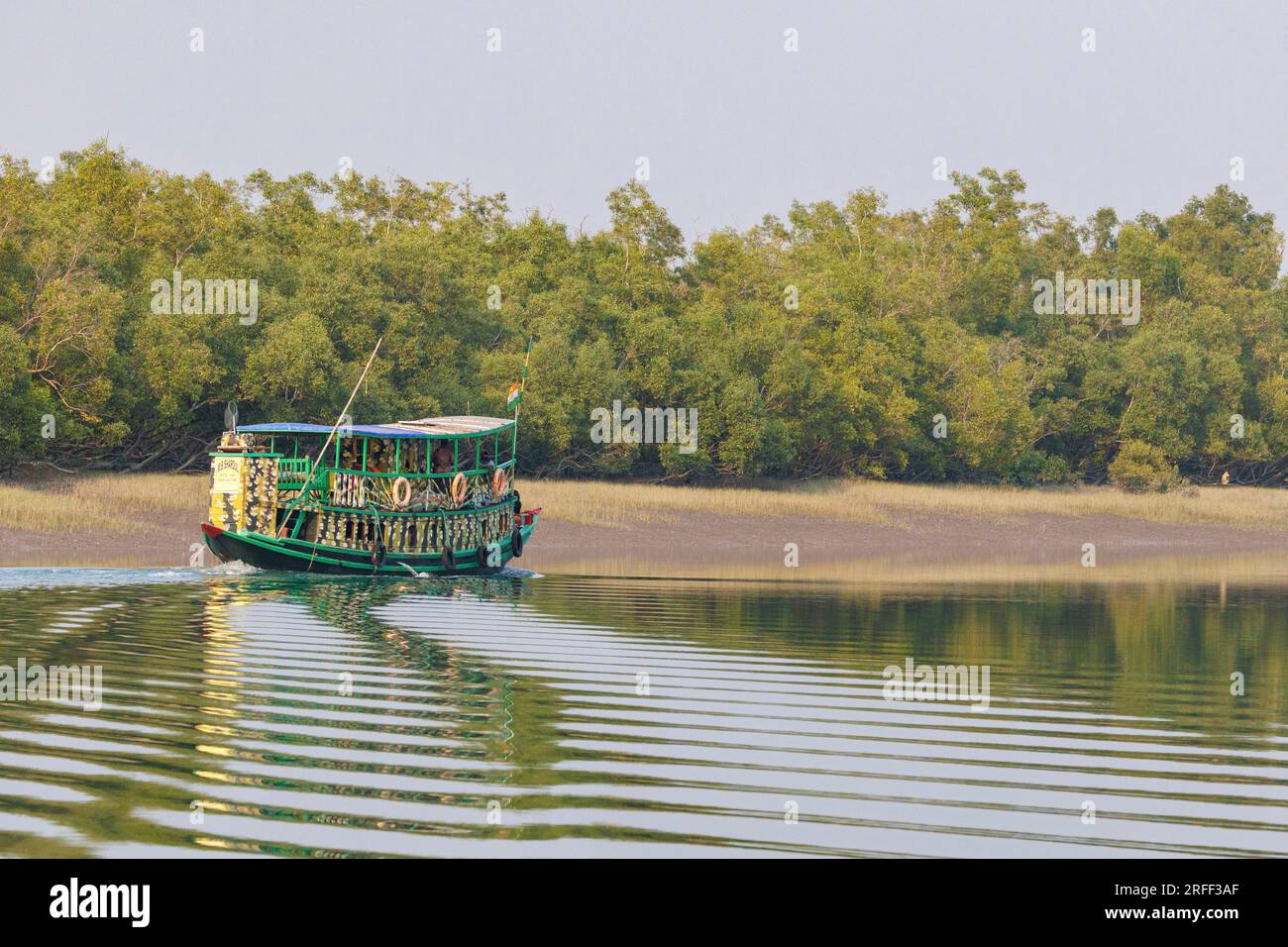 Tourist boat in an inlet of the Sunderbans, Ganges Delta, Bay of Bengal ...