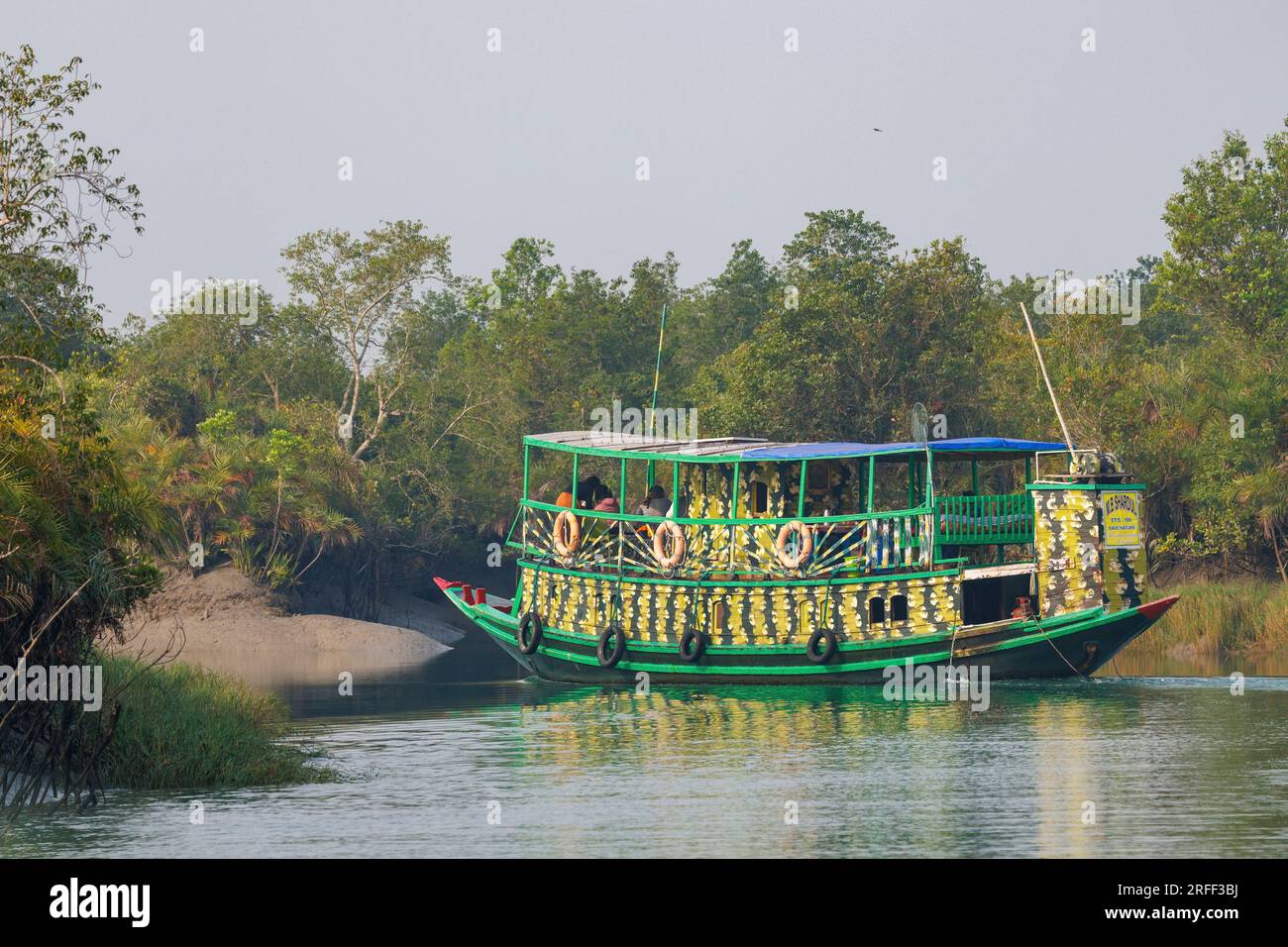 Tourist boat in an inlet of the Sunderbans, Ganges Delta, Bay of Bengal ...