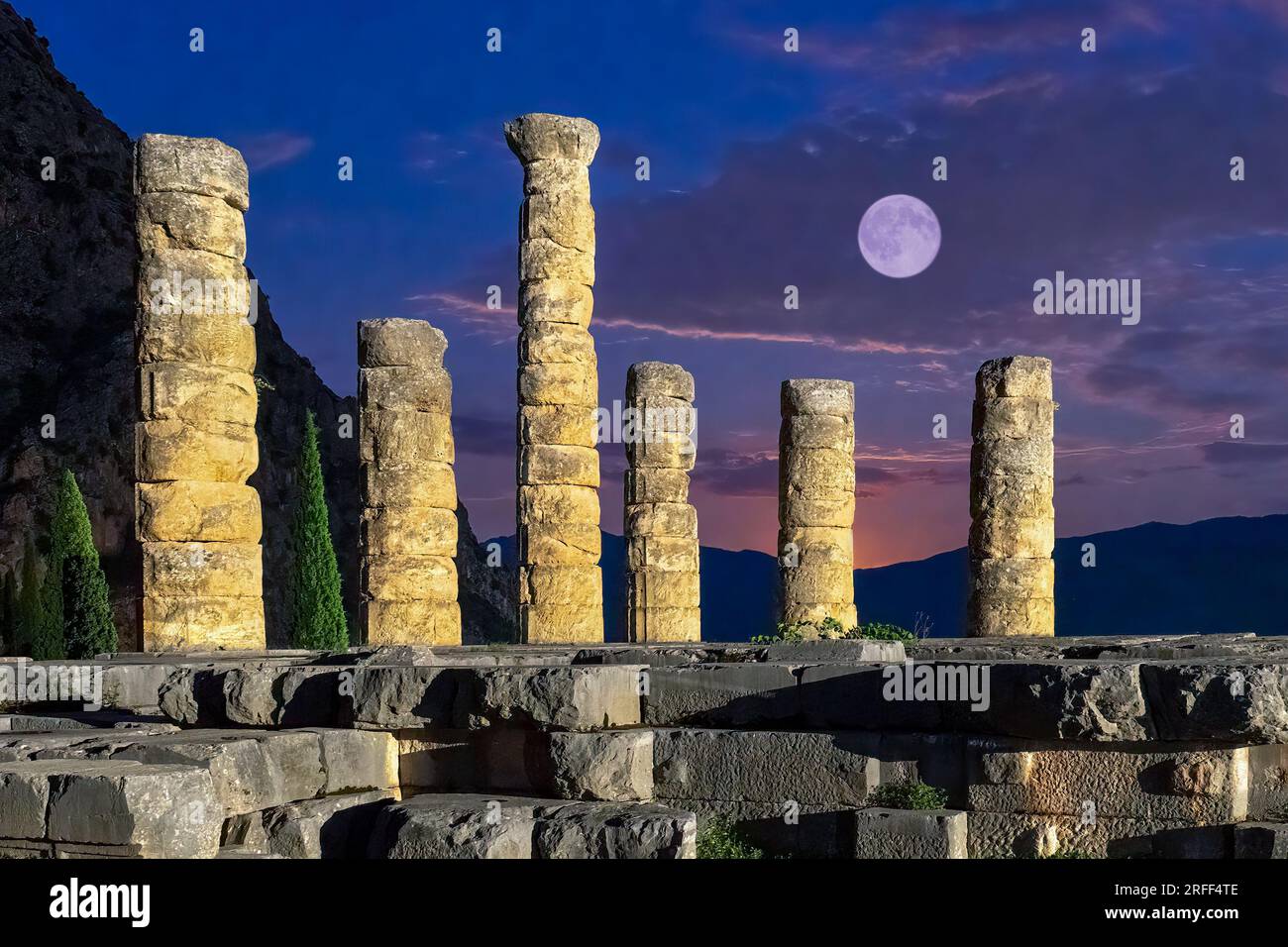 Temple of Apollo at Delphi in Greece during blue hour against the full ...