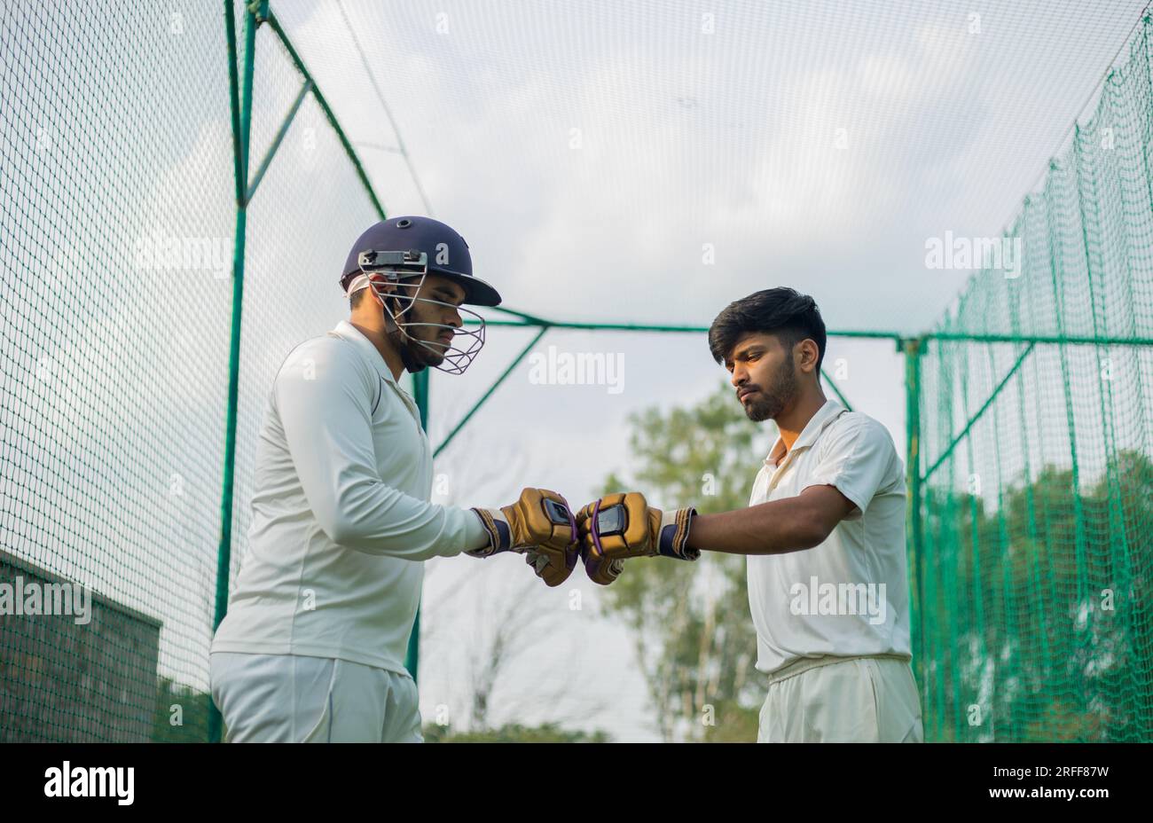 Two cricket players giving fist bump each other after discussion Stock ...