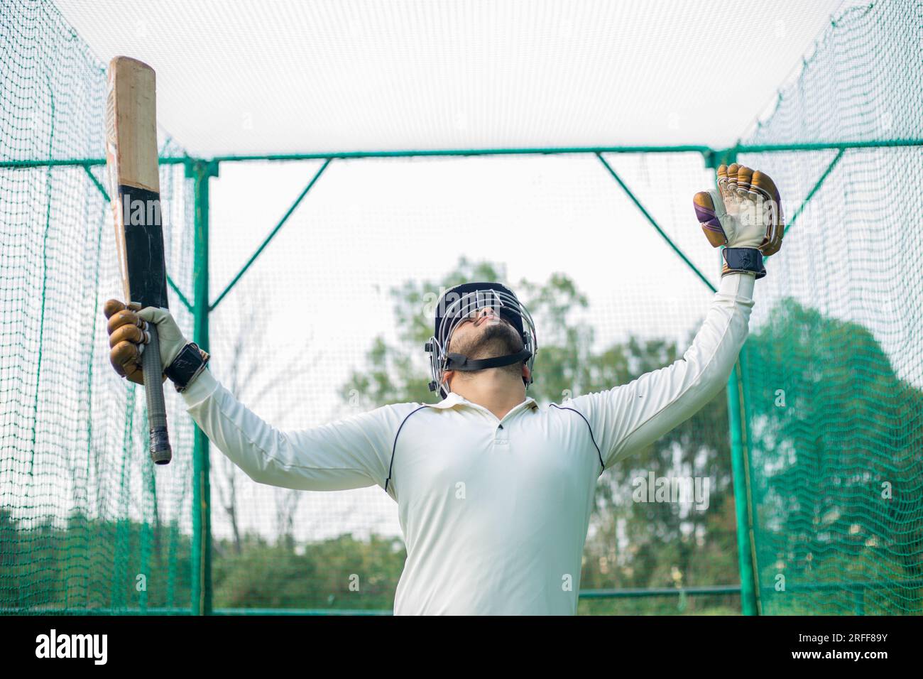 Cricket batsman celebrating his success and feeling happy Stock Photo ...