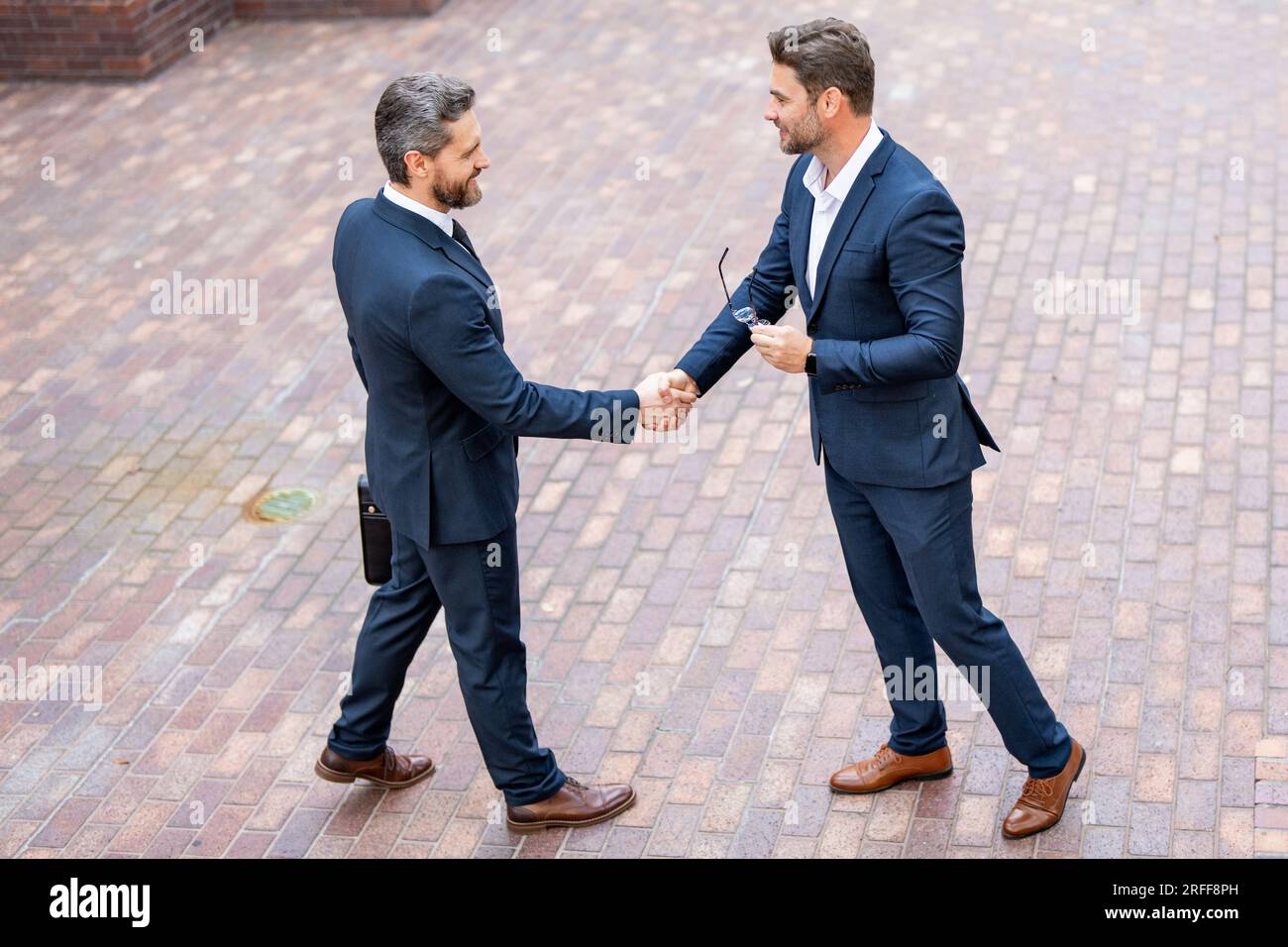 Business team. Businessman handshake with partner. Businessmen in suit ...