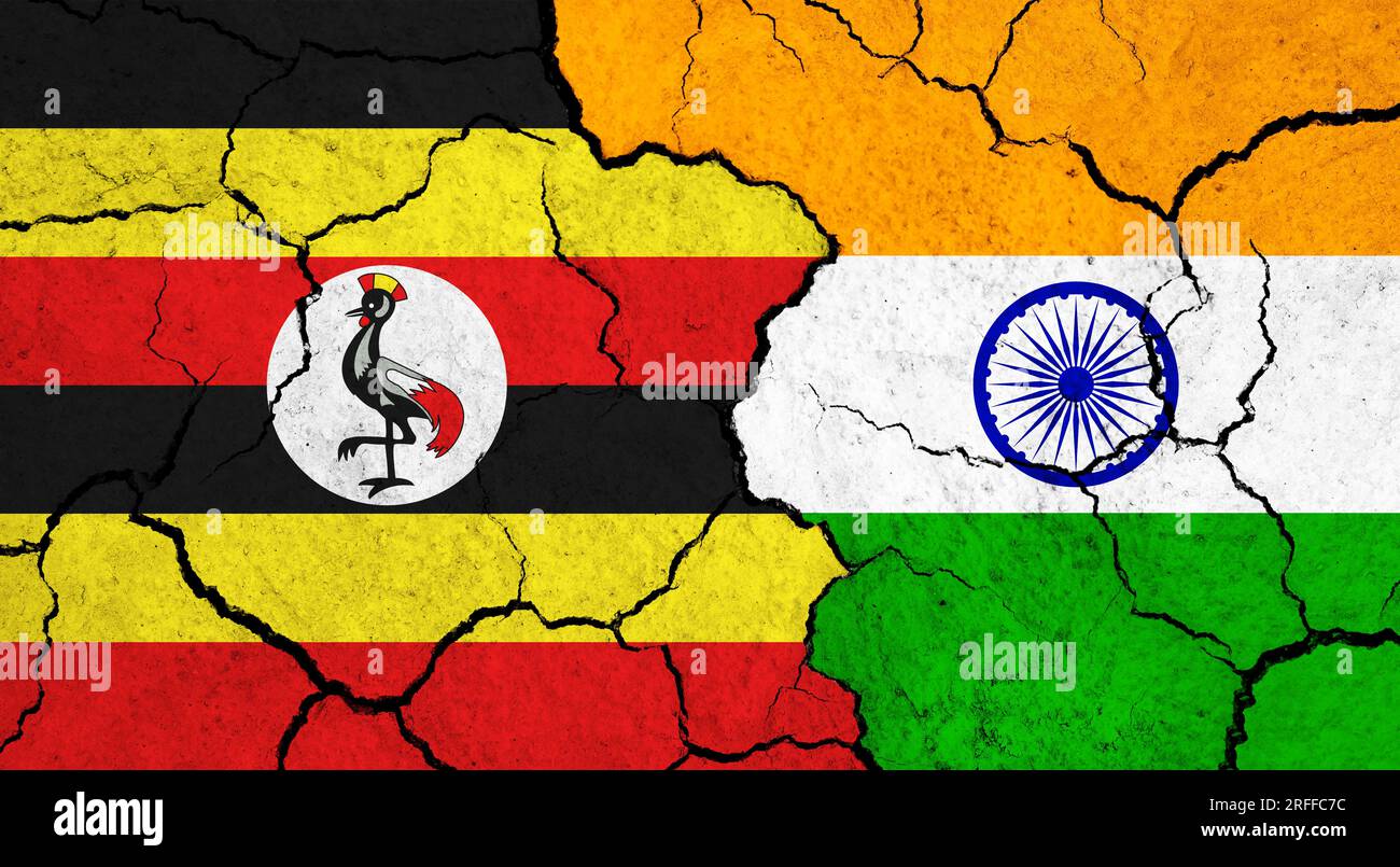 Flags of Uganda and India on cracked surface - politics, relationship ...