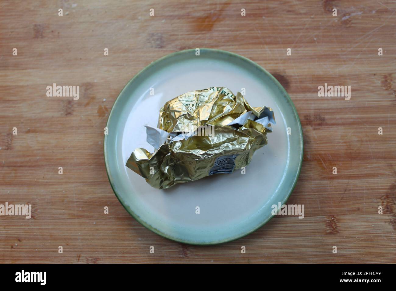 A close up photo of a packet of butter Stock Photo - Alamy
