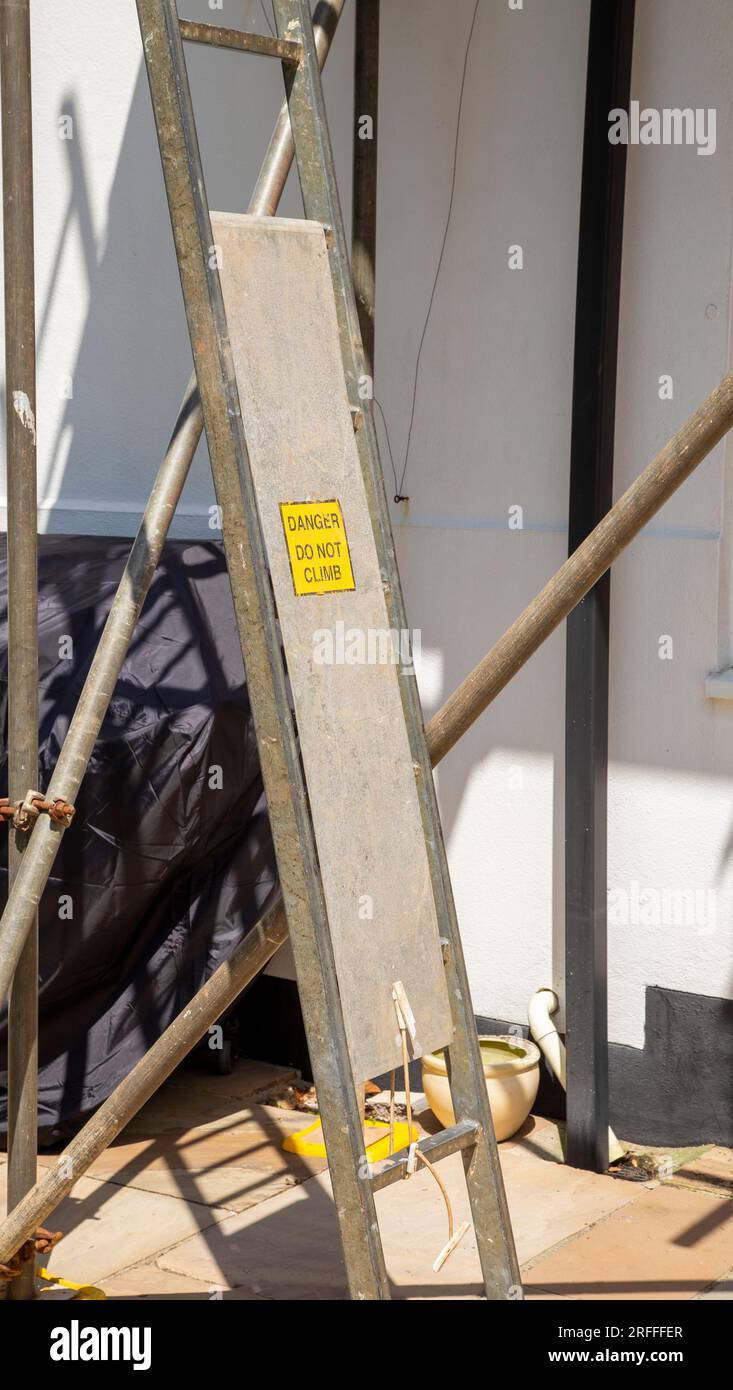 Ladder guard on scaffolding outside a house showing ladder, clamps ...