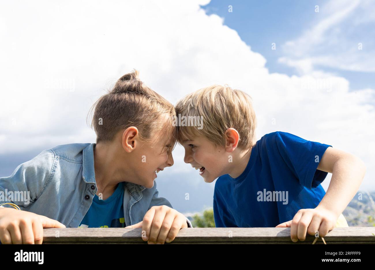 Two faces of 7 year old boy. happy children. Friendship, family concept ...