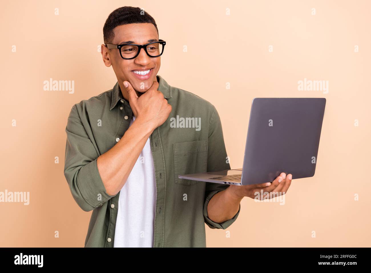 Photo of positive clever minded person hand touch chin watch video ...