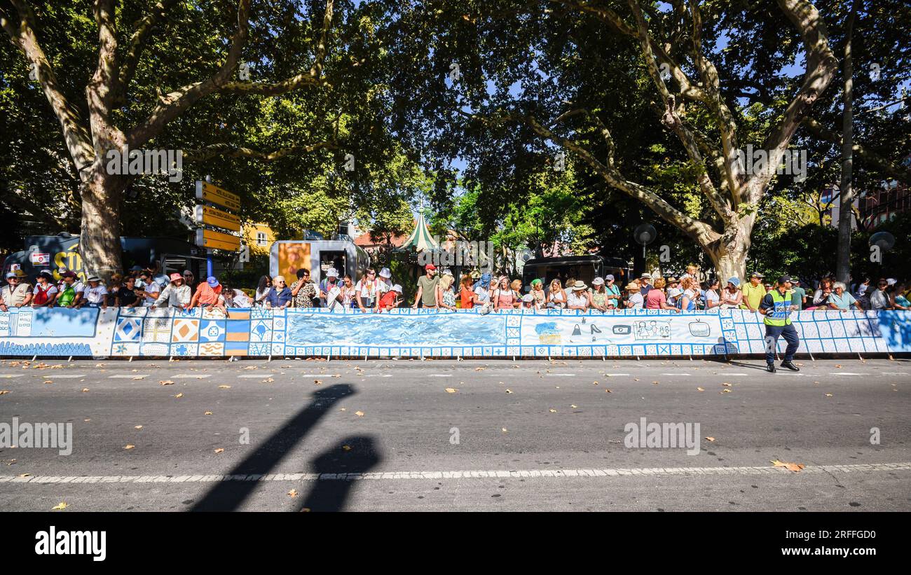 People next to a 3.5 km mural, the largest in the world, painted by the ...