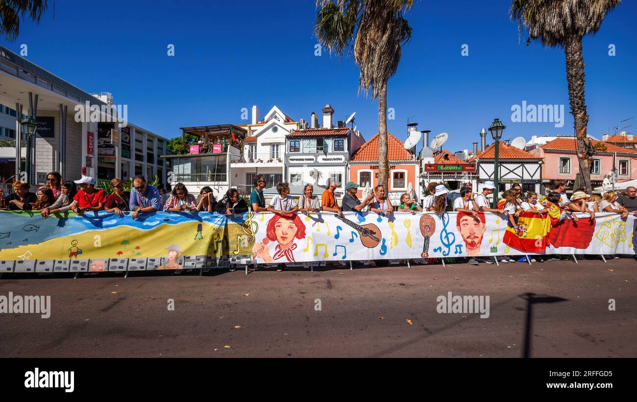 People next to a 3.5 km mural, the largest in the world, painted by the ...