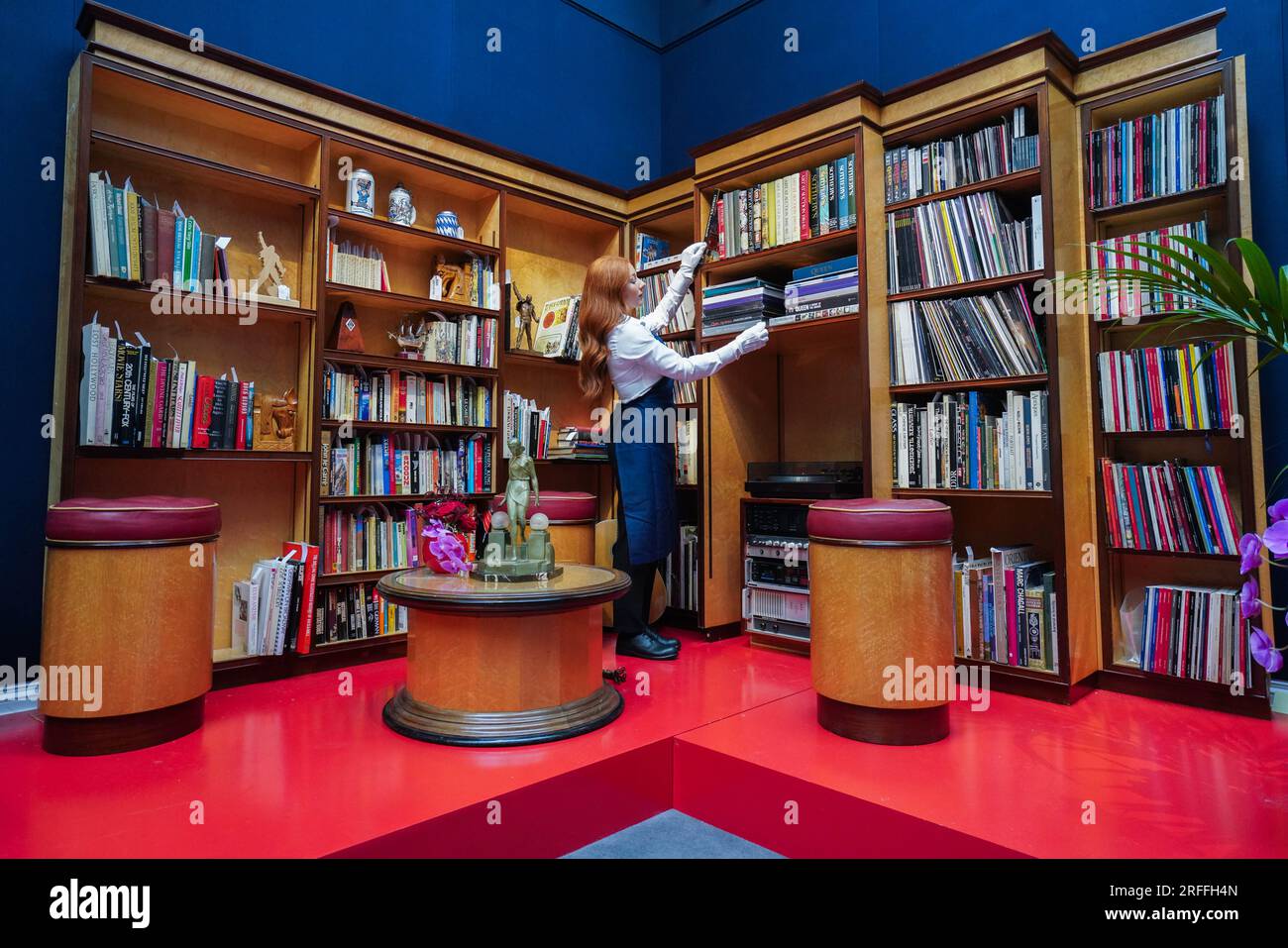 London UK. 3 August 2023 . A maple and mahogany fitted bookcase with ...