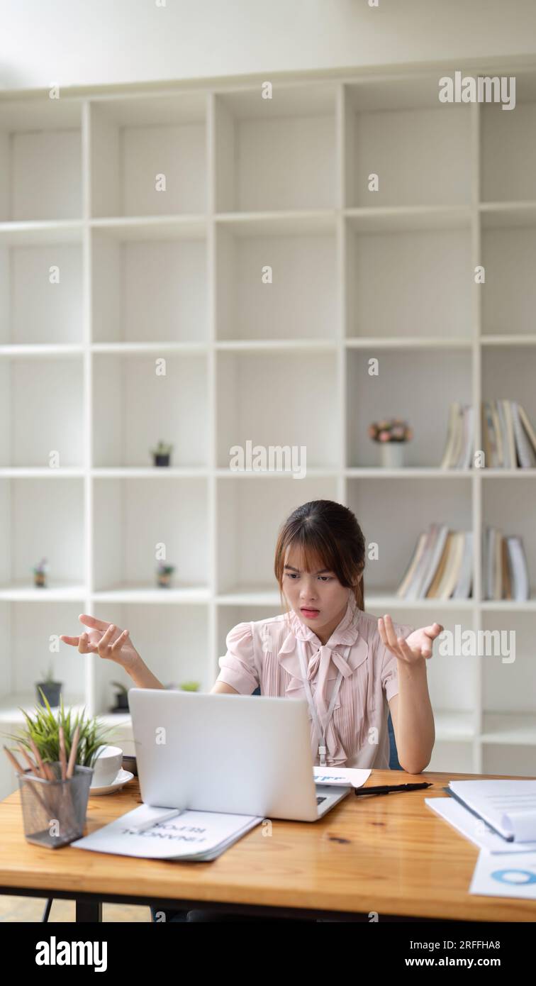 Asian business woman got stressed at work during in the office room ...