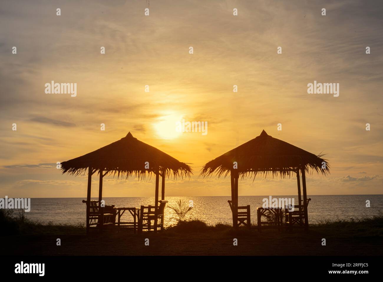 Sea sunset in Thailand. Cozy traditional gazebos by the sea, covered ...