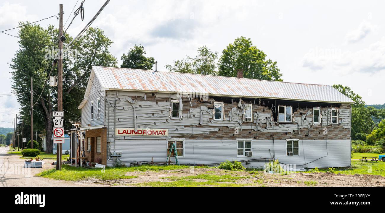 An old, fire damaged building that was once a laundromat and how houses ...