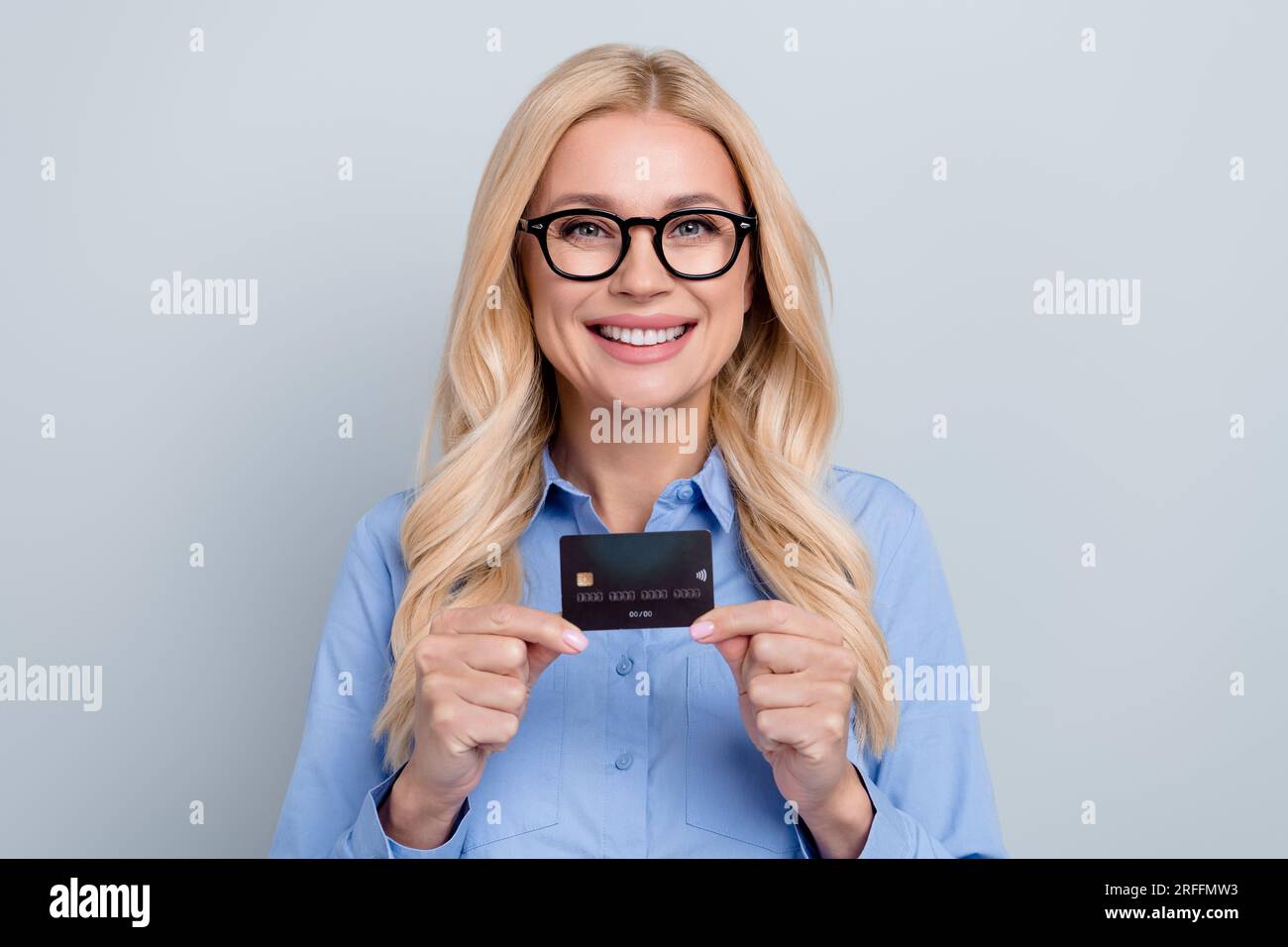 Photo of mature charming business entrepreneur lady banker holding ...
