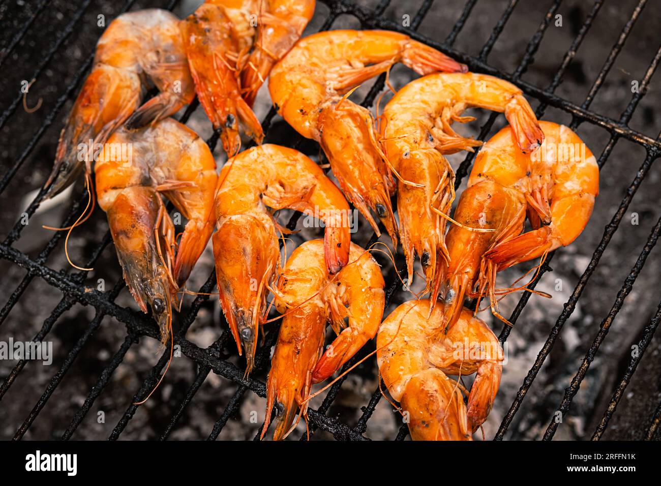 Cooking grilled prawns on barbecue. BBQ shrimps, close up Stock Photo ...