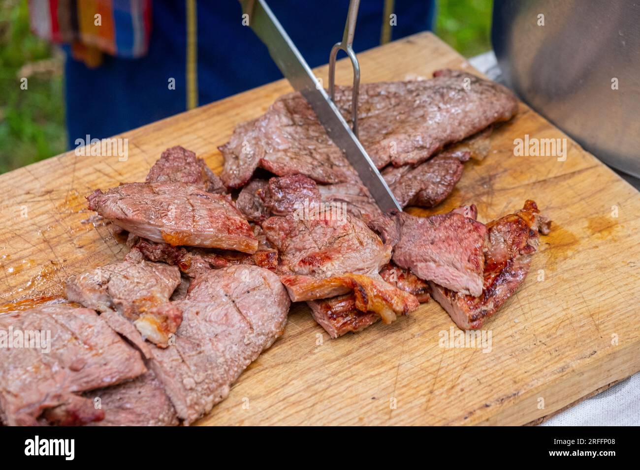chopping up freshly slaughtered organic beef Stock Photo - Alamy
