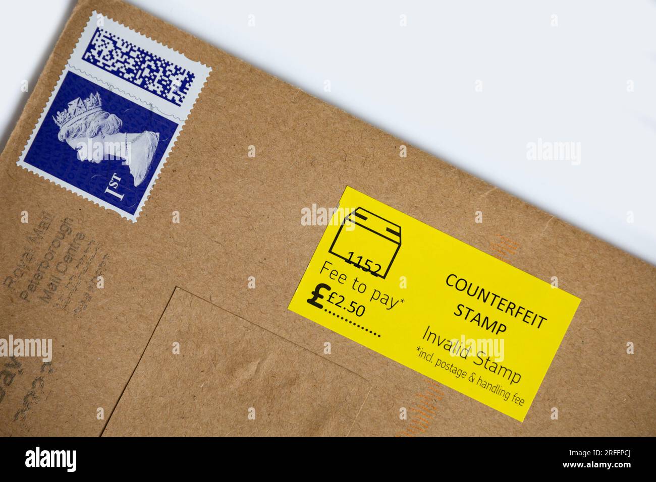 Royal Mail counterfeit 1st class Queen Elizabeth stamp on brown paper ...