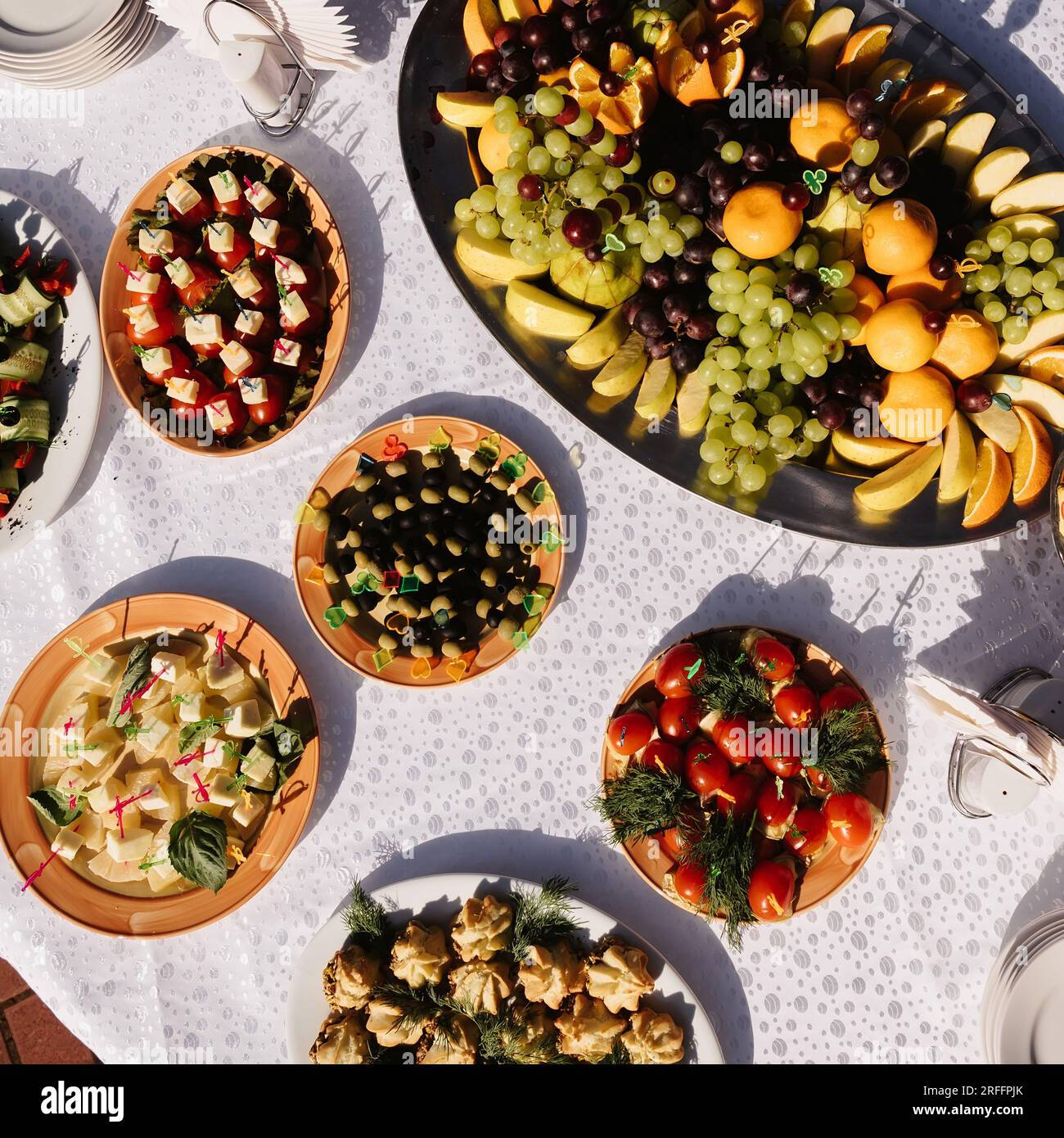 vegetarian festive table with fruits and vegetables in plates Stock ...