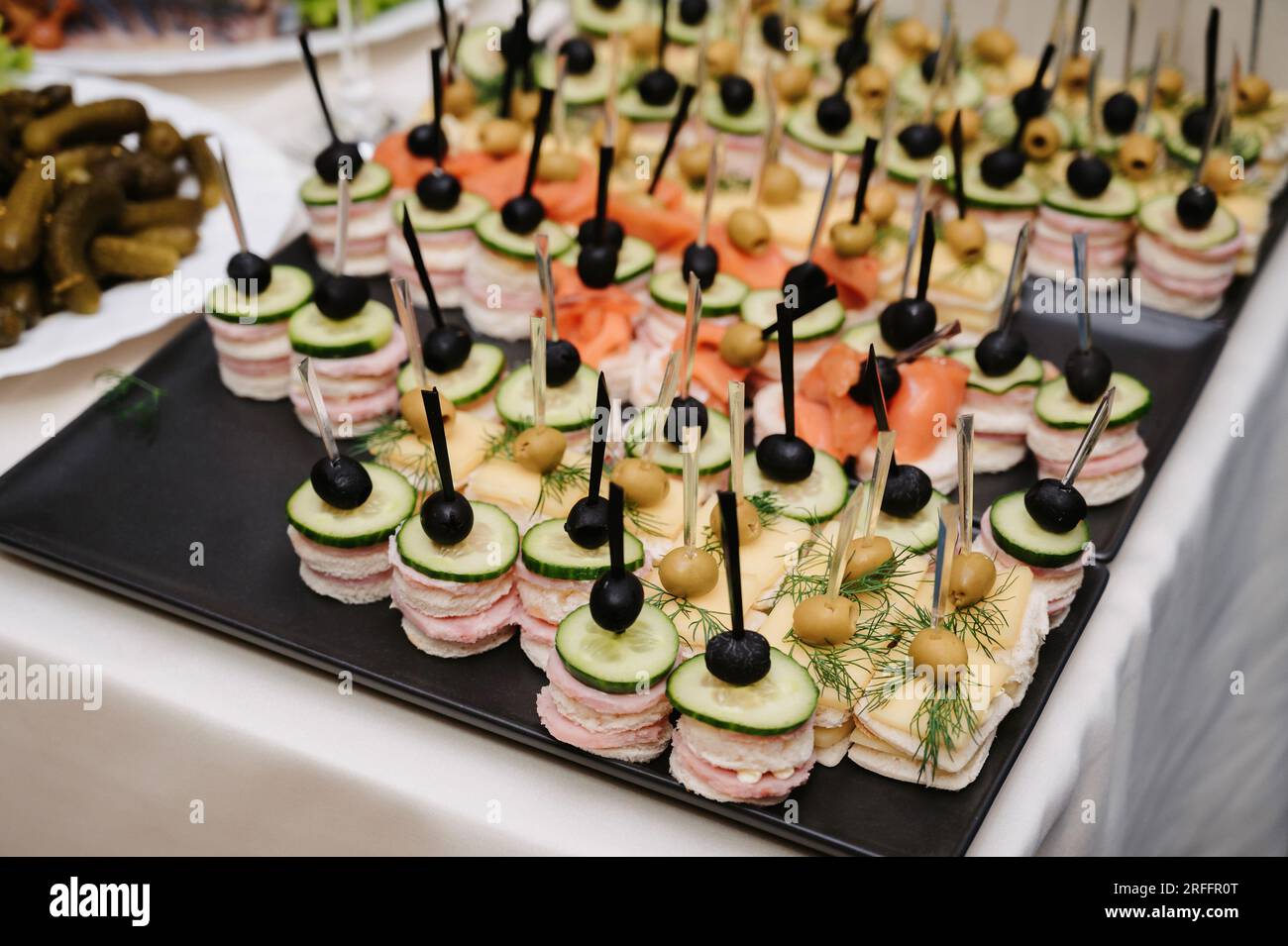 various canapes for snacks on the festive table at the event Stock ...