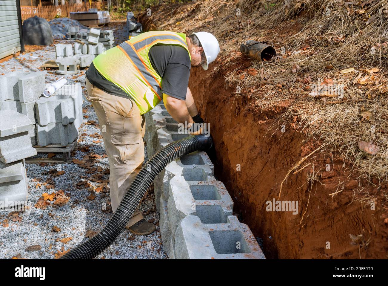 Construction engineer are laying drainage pipe for rainwater in ...