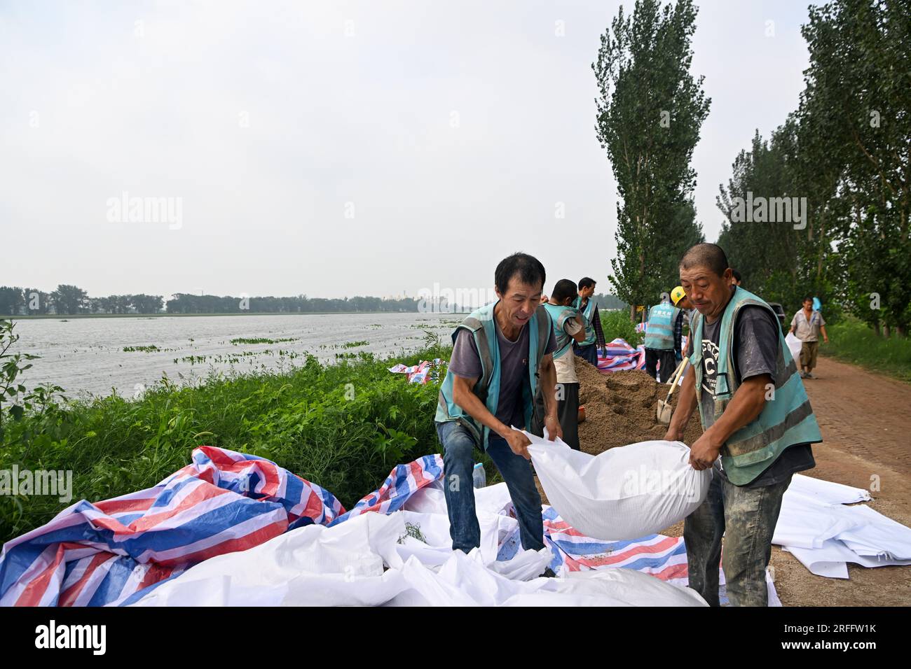 Tianjin, China's Tianjin Municipality. 3rd Aug, 2023. Workers conduct ...