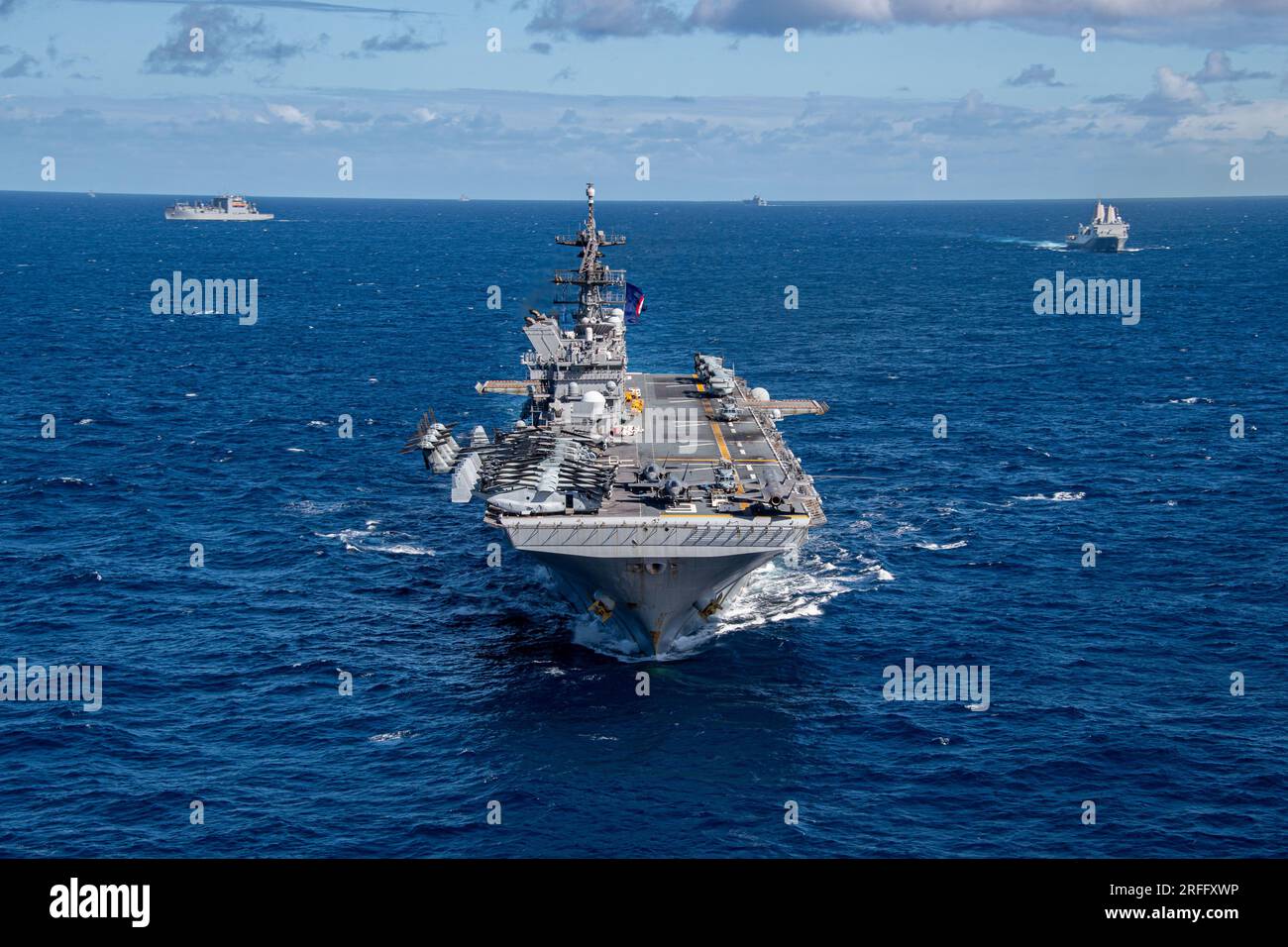 Amphibious assault ship USS America sails in a formation exercise at ...