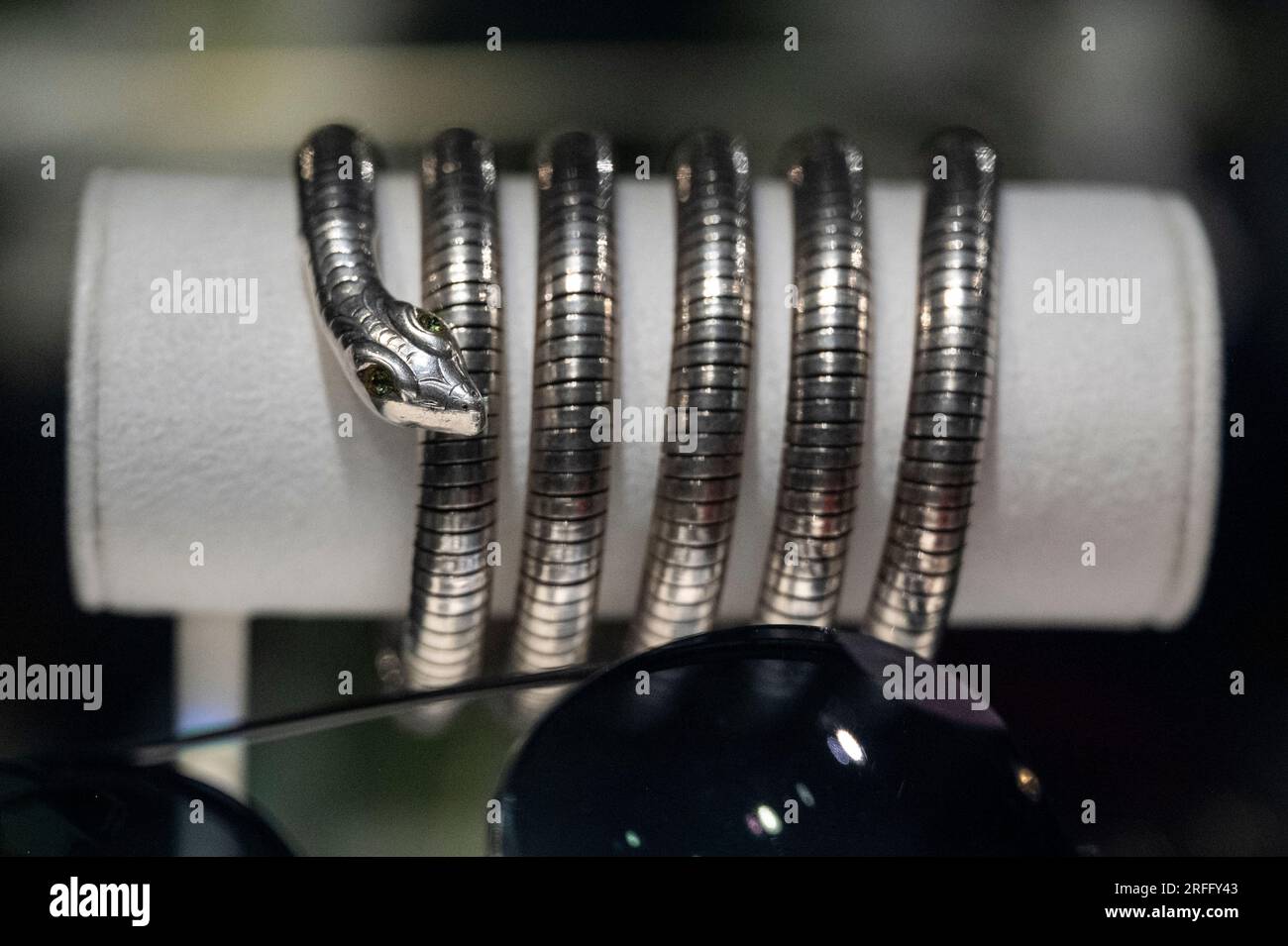 London, UK. 3 August 2023. 'Silver snake bangle worn in the Bohemian ...