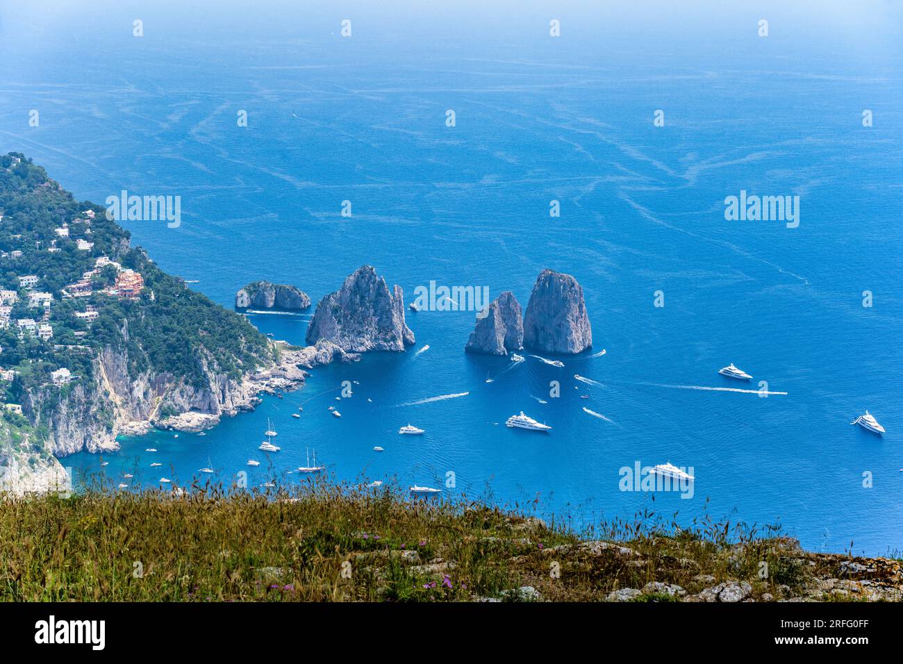 View of Anacapri and Faraglioni sea stacks from the summit of Monte ...