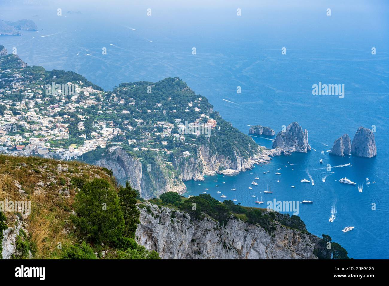 View of Anacapri and Faraglioni sea stacks from the summit of Monte ...